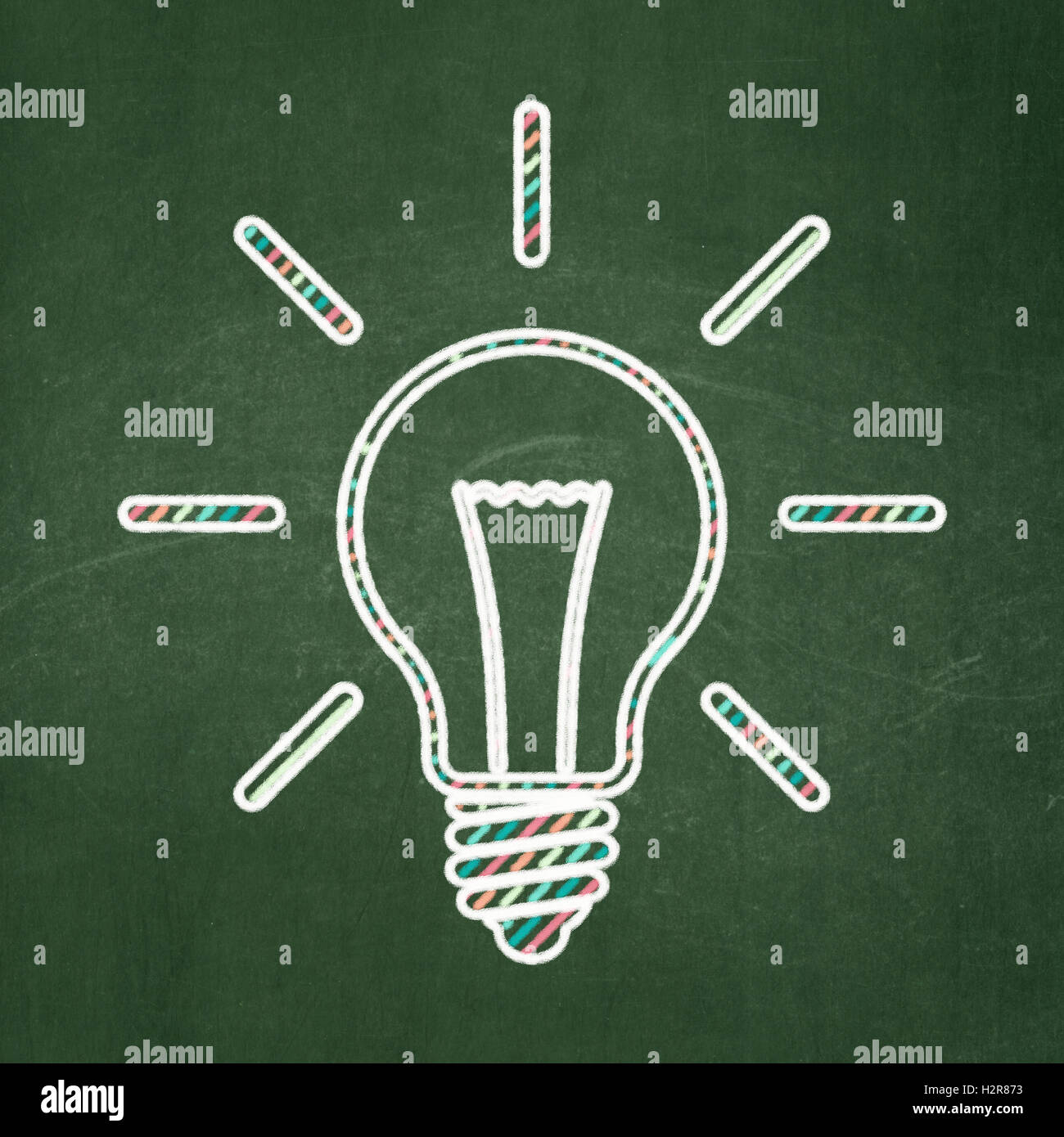 Finance concept: Light Bulb on chalkboard background Stock Photo - Alamy