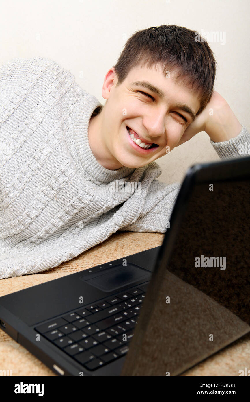 Cheerful Teenager with Laptop Stock Photo - Alamy
