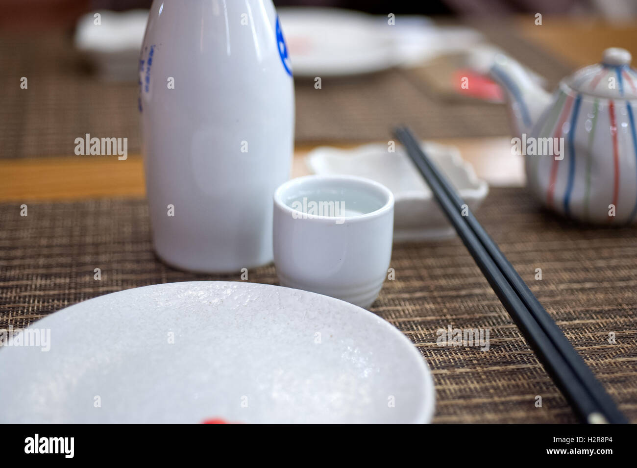 Japanese style table set and sake Stock Photo - Alamy