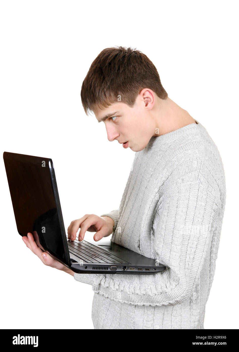 Busy Teenager with Laptop Stock Photo - Alamy