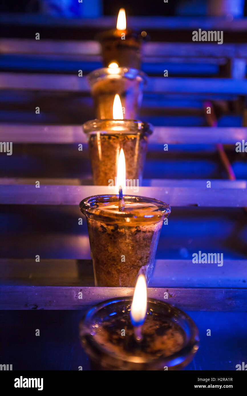 Closeup of burning candles in the Catholic Church Stock Photo - Alamy