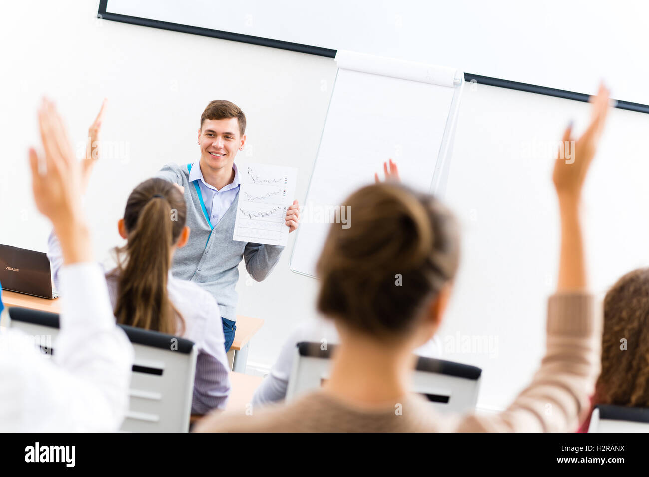 teacher talking with students Stock Photo - Alamy