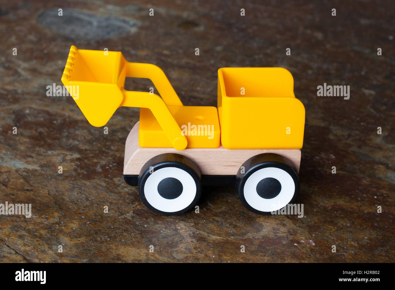 Simple wheel dozer toy Stock Photo - Alamy
