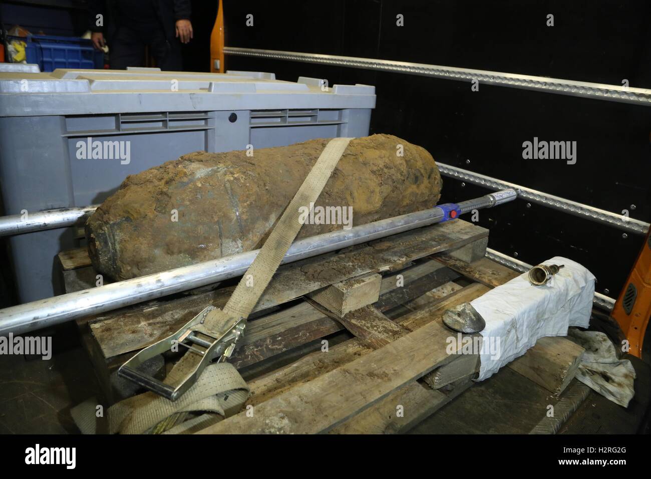 A defused aerial bomb from the Second World War lies on a wood palette ...