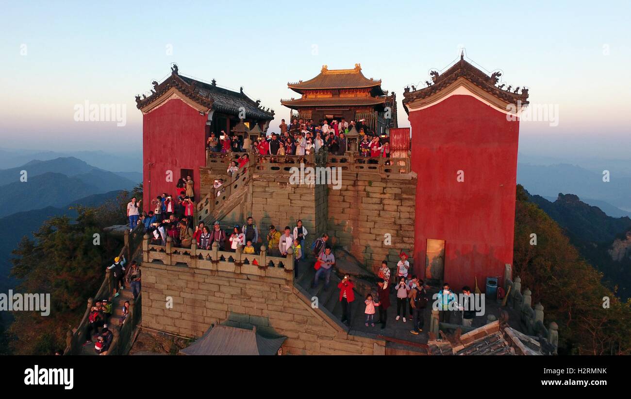 Wudang Mountain. 2nd Oct, 2016. Tourists watch sunrise at the Golden ...