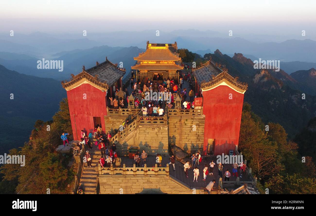 Wudang Mountain. 2nd Oct, 2016. Tourists watch sunrise at the Golden ...