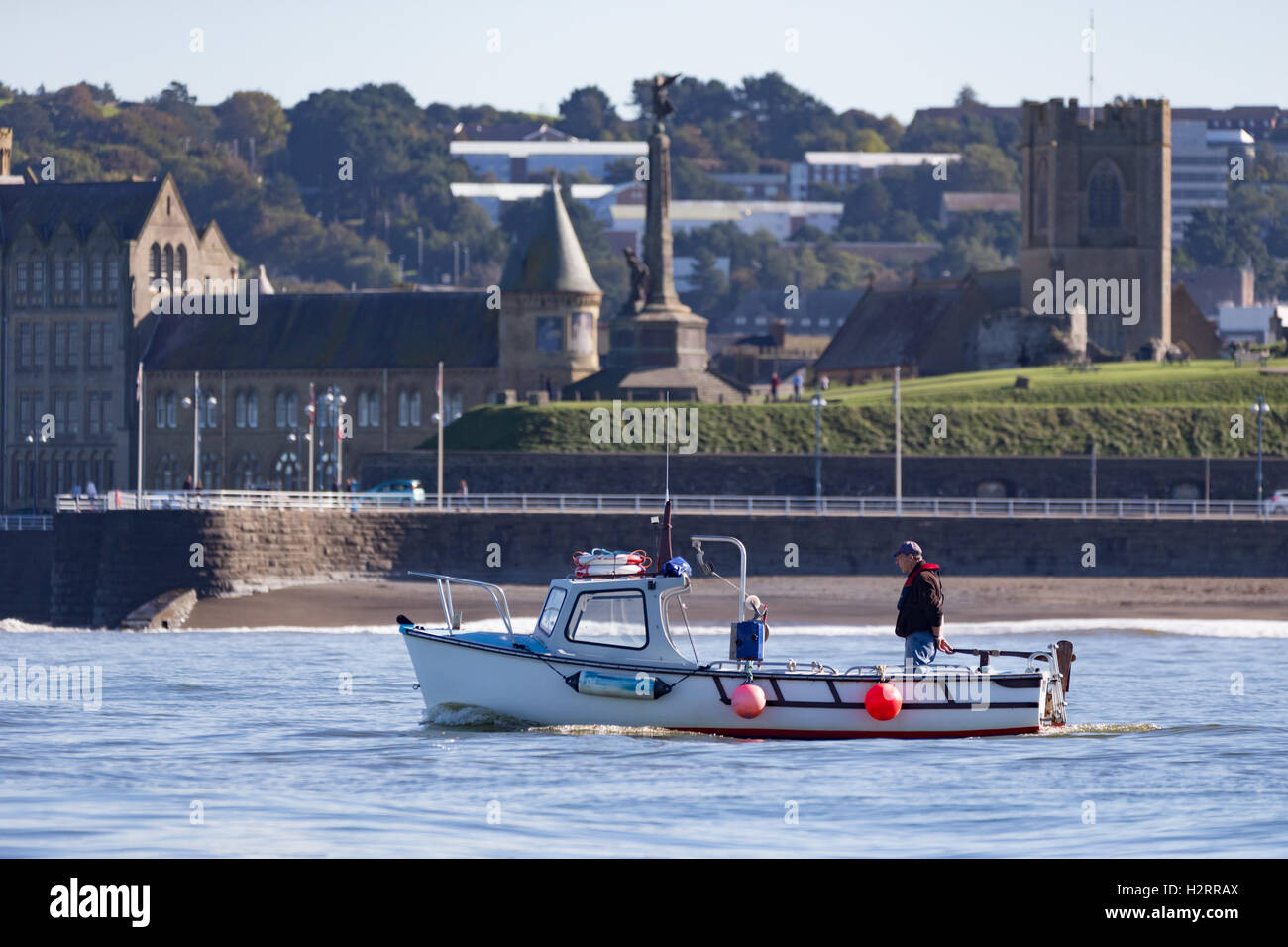A man standing in his boat just off Aberystwyth Stock Photo - Alamy