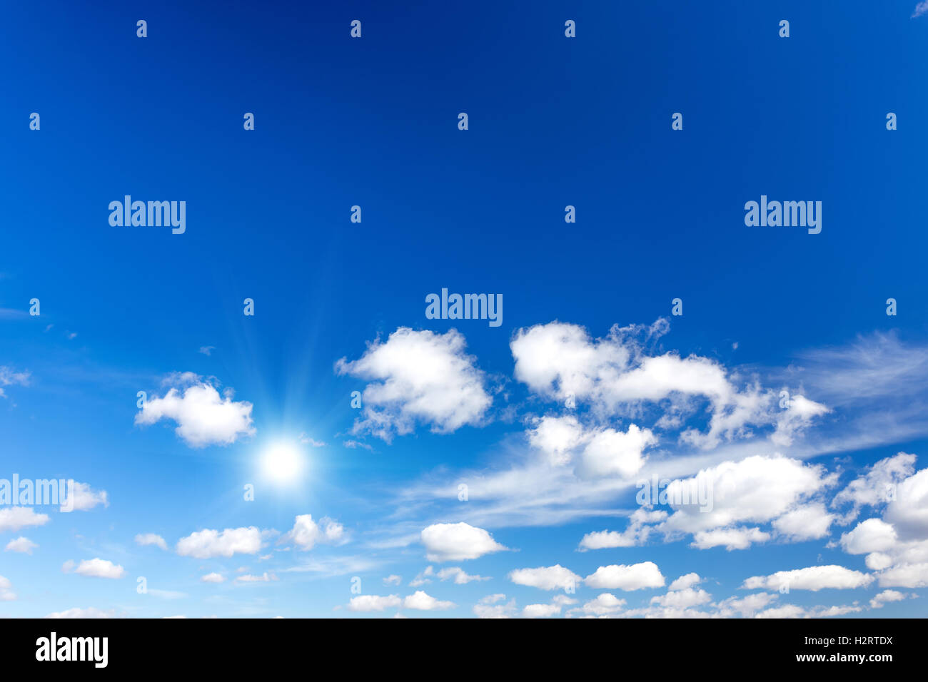 Blue sky with sun Stock Photo - Alamy