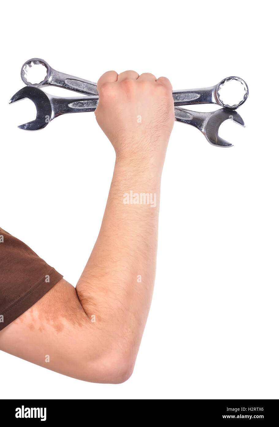 Worker holding wrench Stock Photo - Alamy