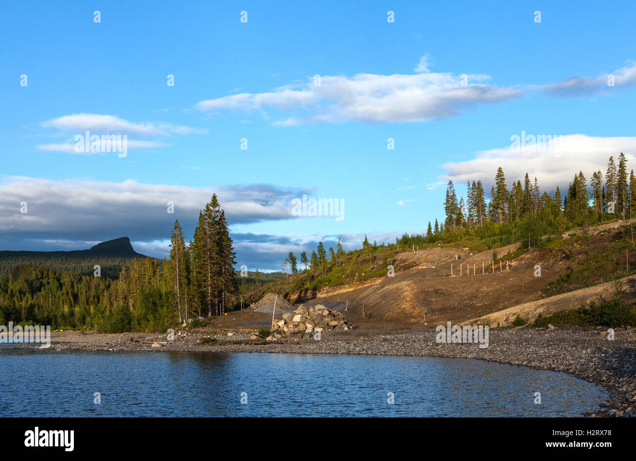 Empty plots, land for sale by a mountain lake. Plots on a slope under ...