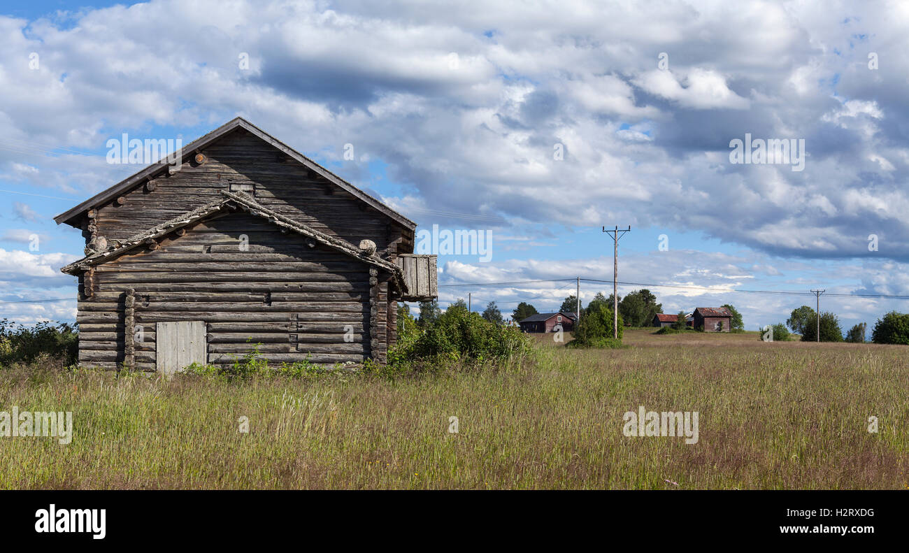 Wooden barn, timber building in the farmland. Agriculture in rural ...