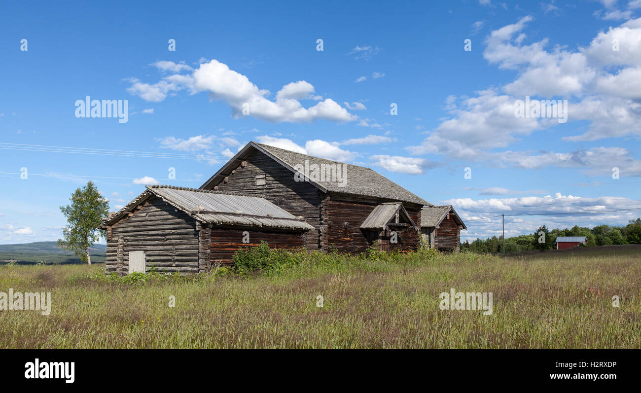 Wooden barn, timber building in the farmland. Agriculture in rural ...