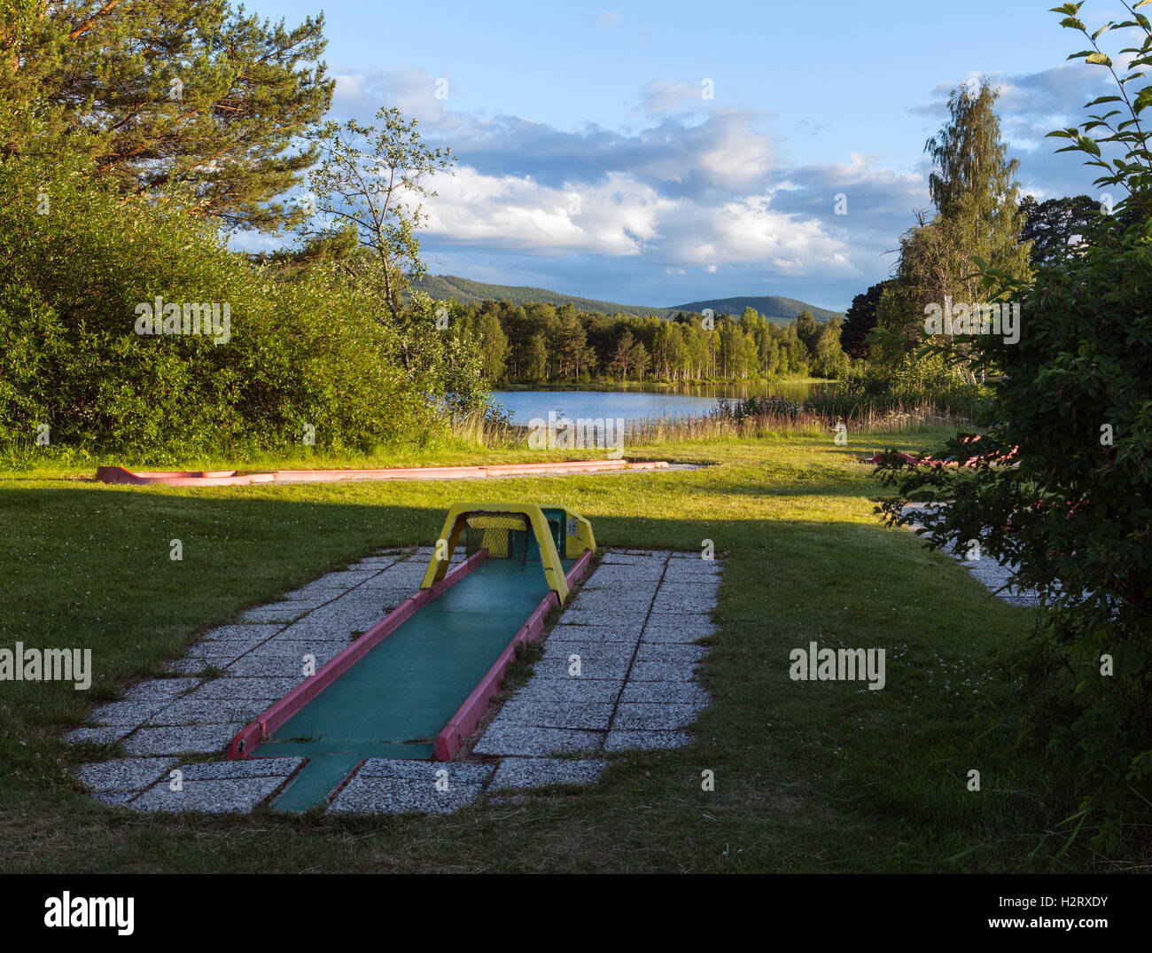 Mini golf course ready to play. River, forests and hills in the ...