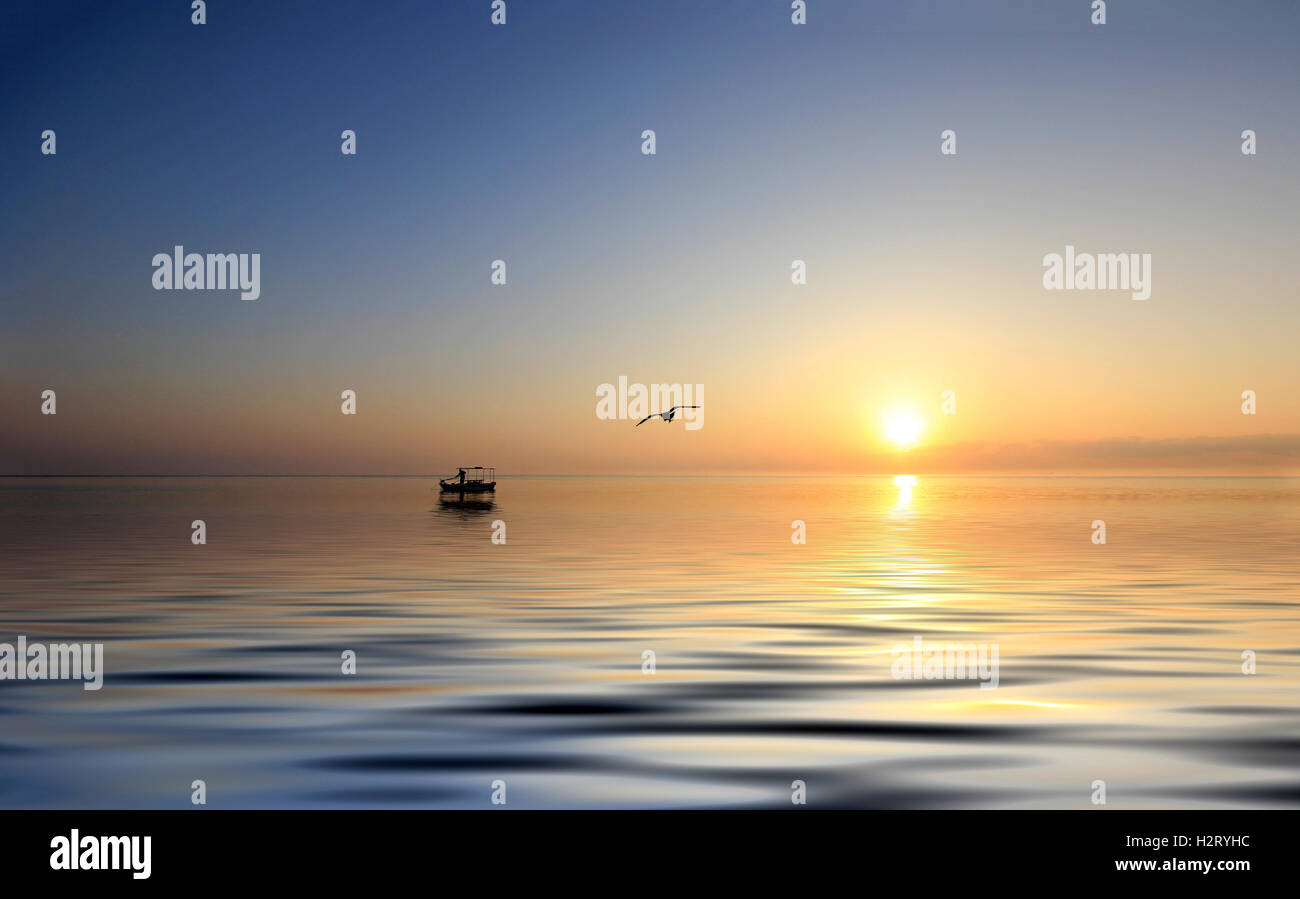 Sunrise over the Ionian sea with fishing boat on Zakynthos island ...