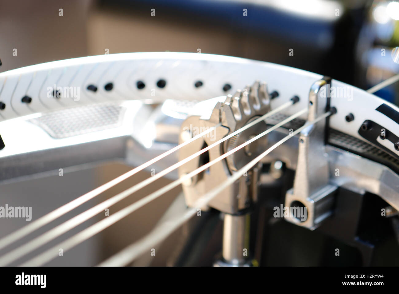 A older white male stringing a tennis racket Stock Photo - Alamy