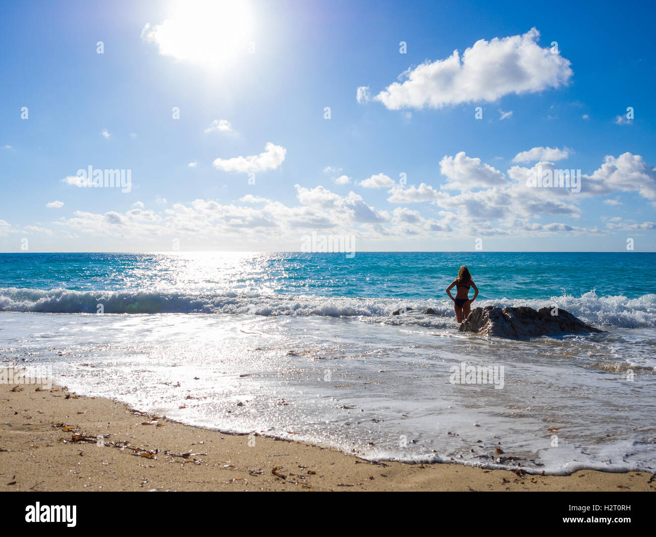 Woman looking at the beach in Kathisma Lefkada Greece Stock Photo - Alamy