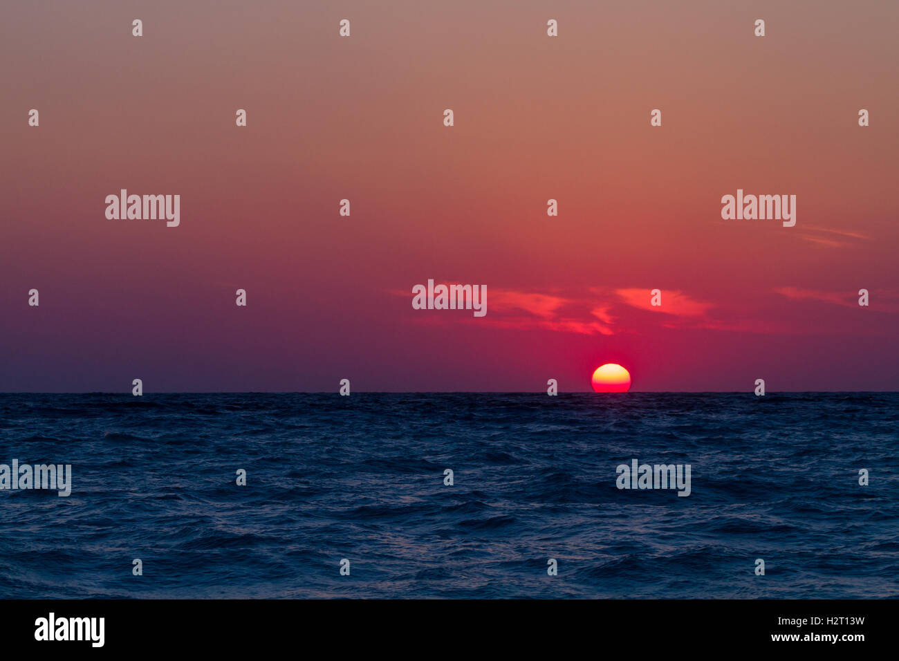 Sunset over the Ionian sea in Greece Stock Photo - Alamy