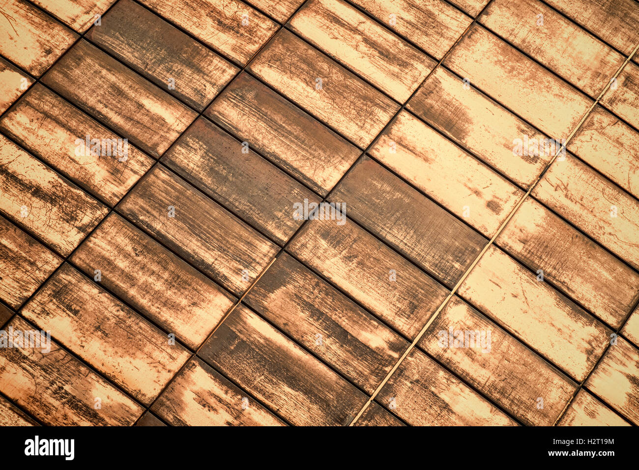 Full frame take of a rusty metal structure of many rectangular tiles ...