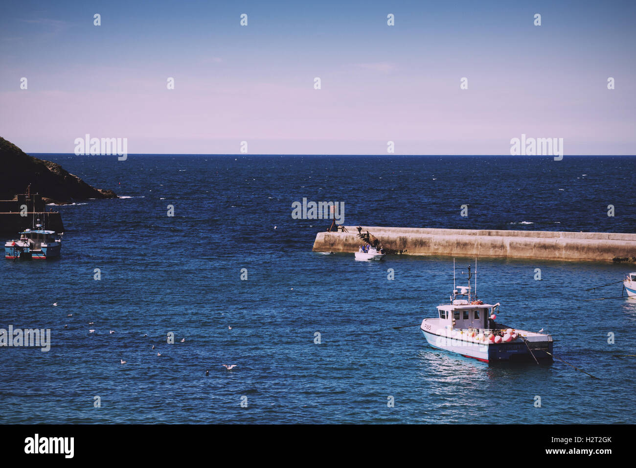 View of the harbour at Port Issac, Cornwall Vintage Retro Filter Stock ...