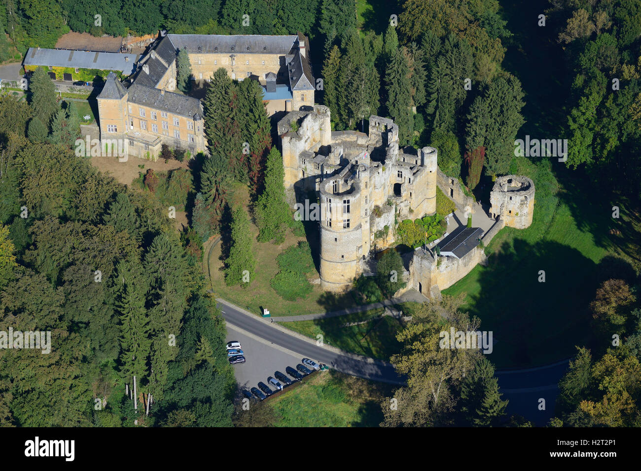 AERIAL VIEW. Abandoned medieval castle next to a renaissance castle ...