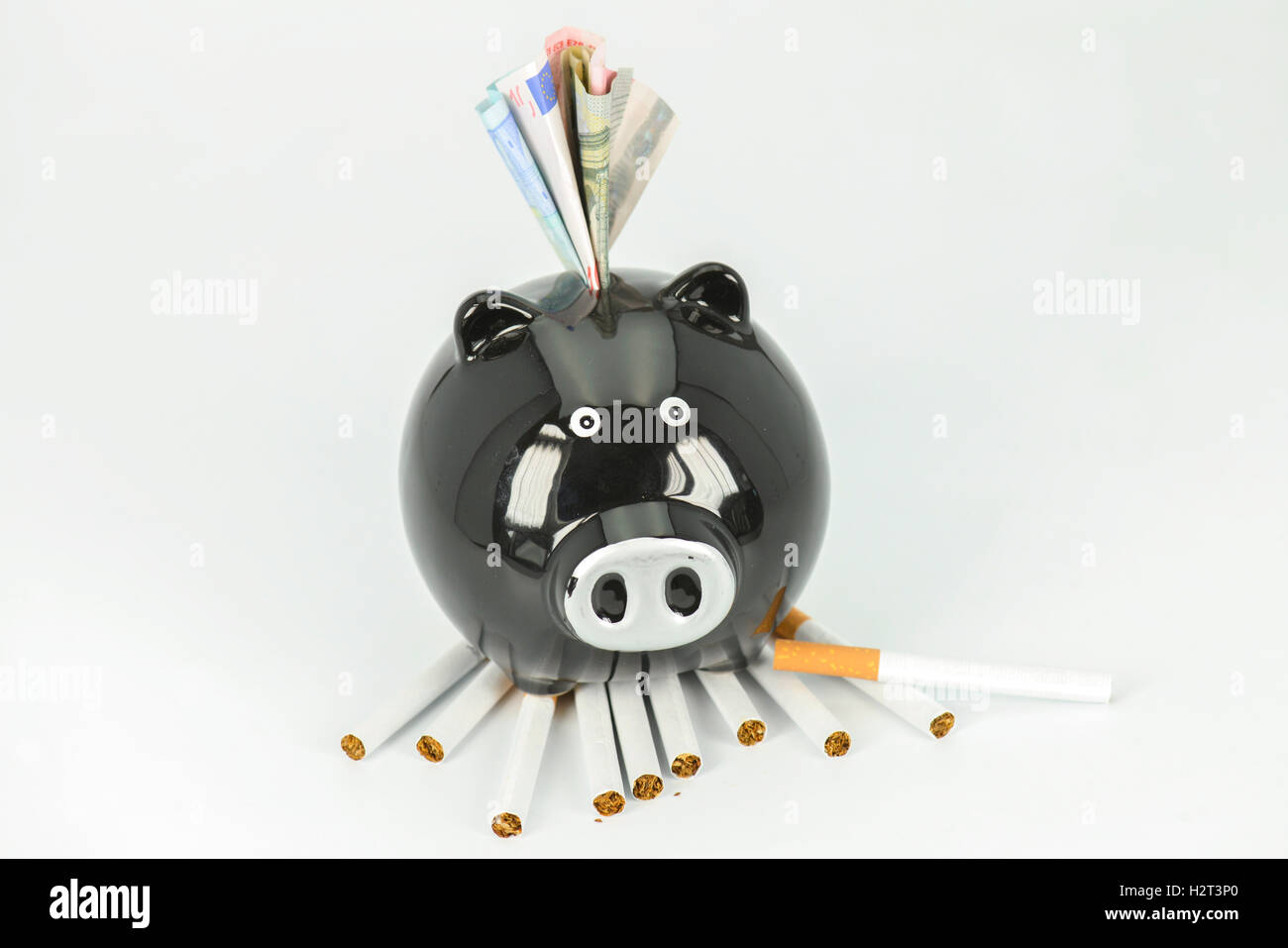 Smoking costs money Stock Photo - Alamy