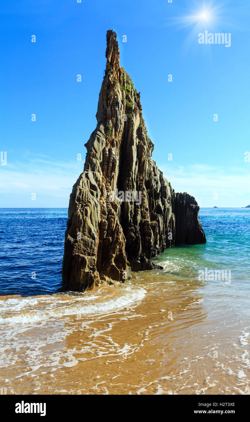 Sunshine sandy Mexota beach and pointed rock. Atlantic Ocean coast ...