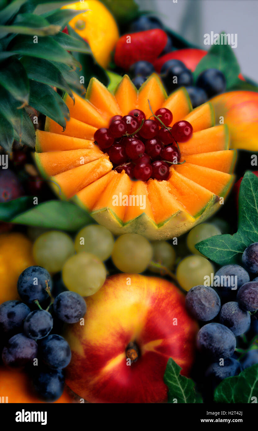 Variety of fruits, apple, grapes, melon, red currants Stock Photo - Alamy