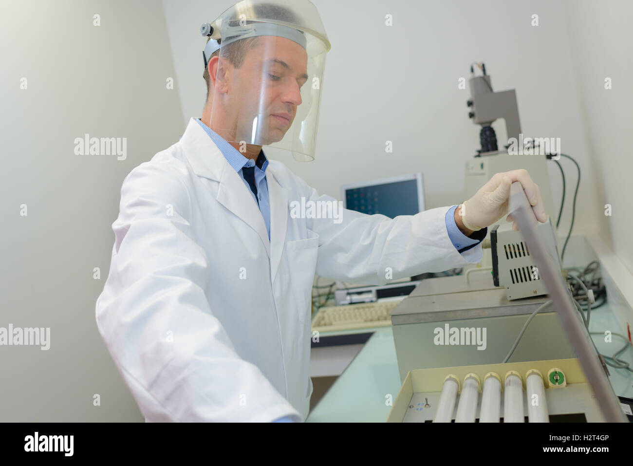 handsome scientist doing reserches with state of the art machines Stock ...