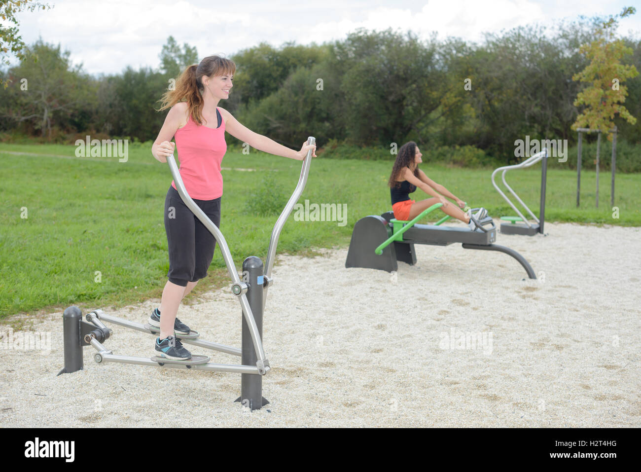 Two women working out in park Stock Photo - Alamy