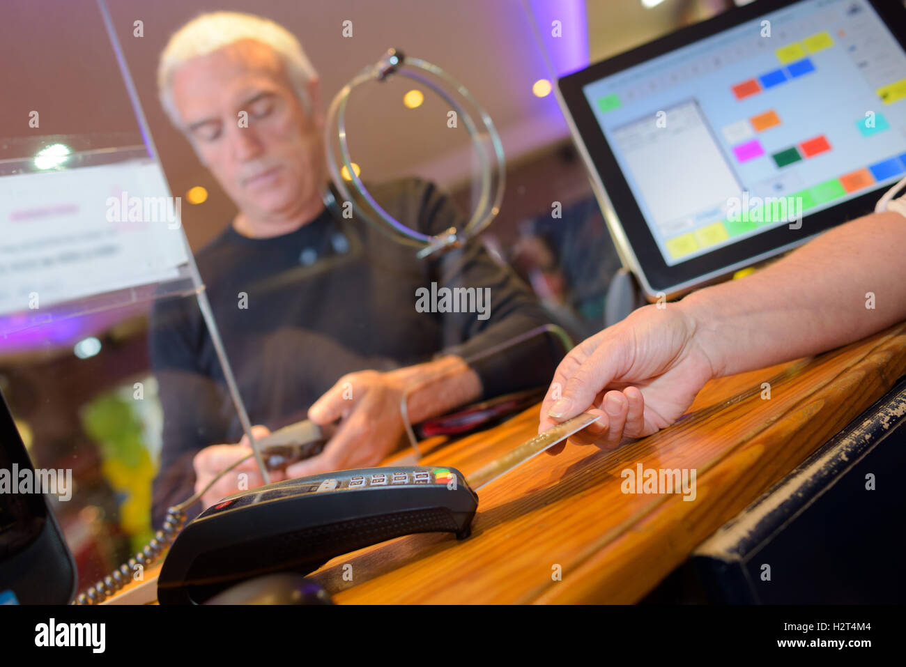 Card payment at ticket booth Stock Photo - Alamy