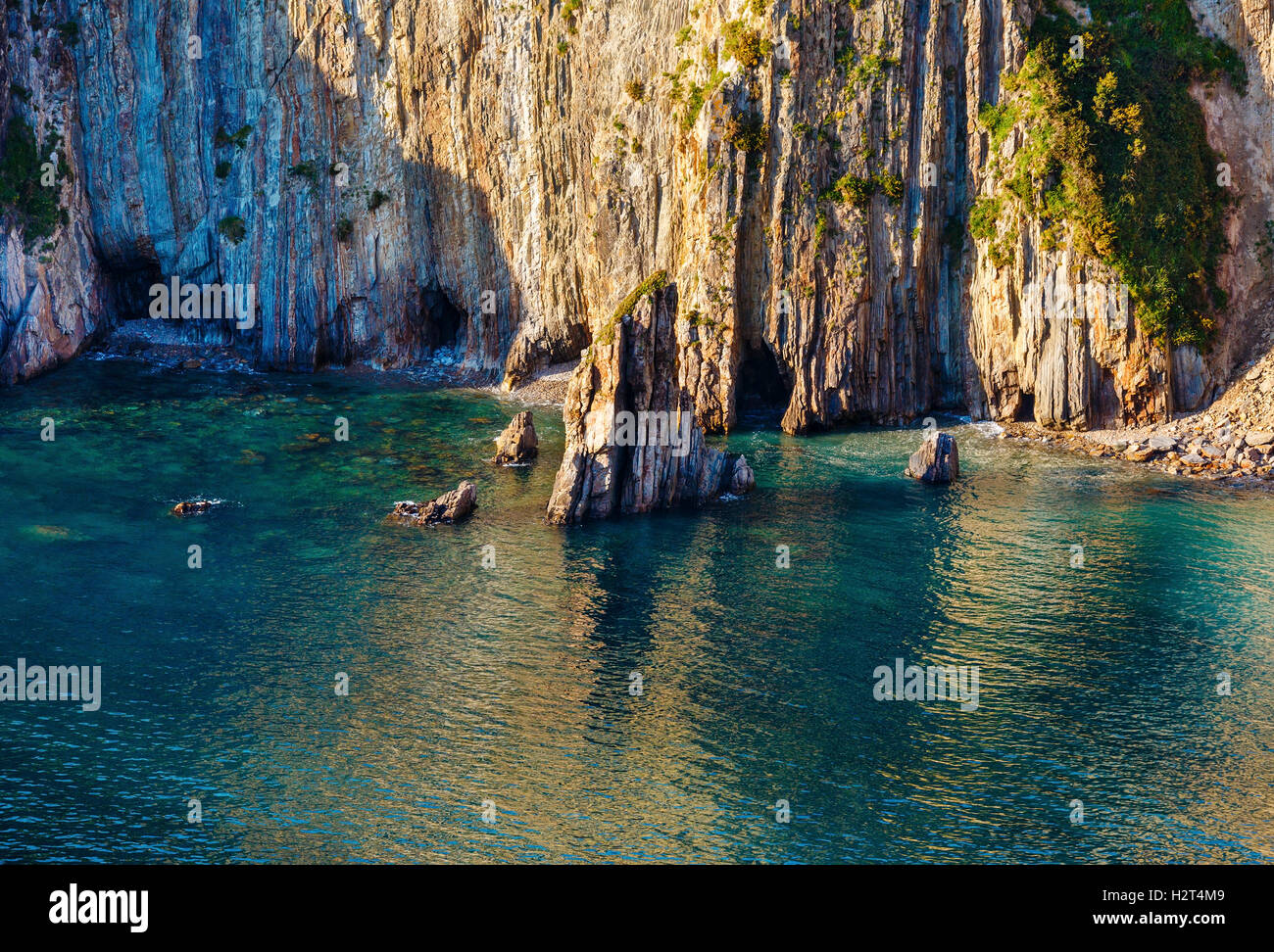 Summer rocky coast (cliff closeup) and sea water Stock Photo - Alamy