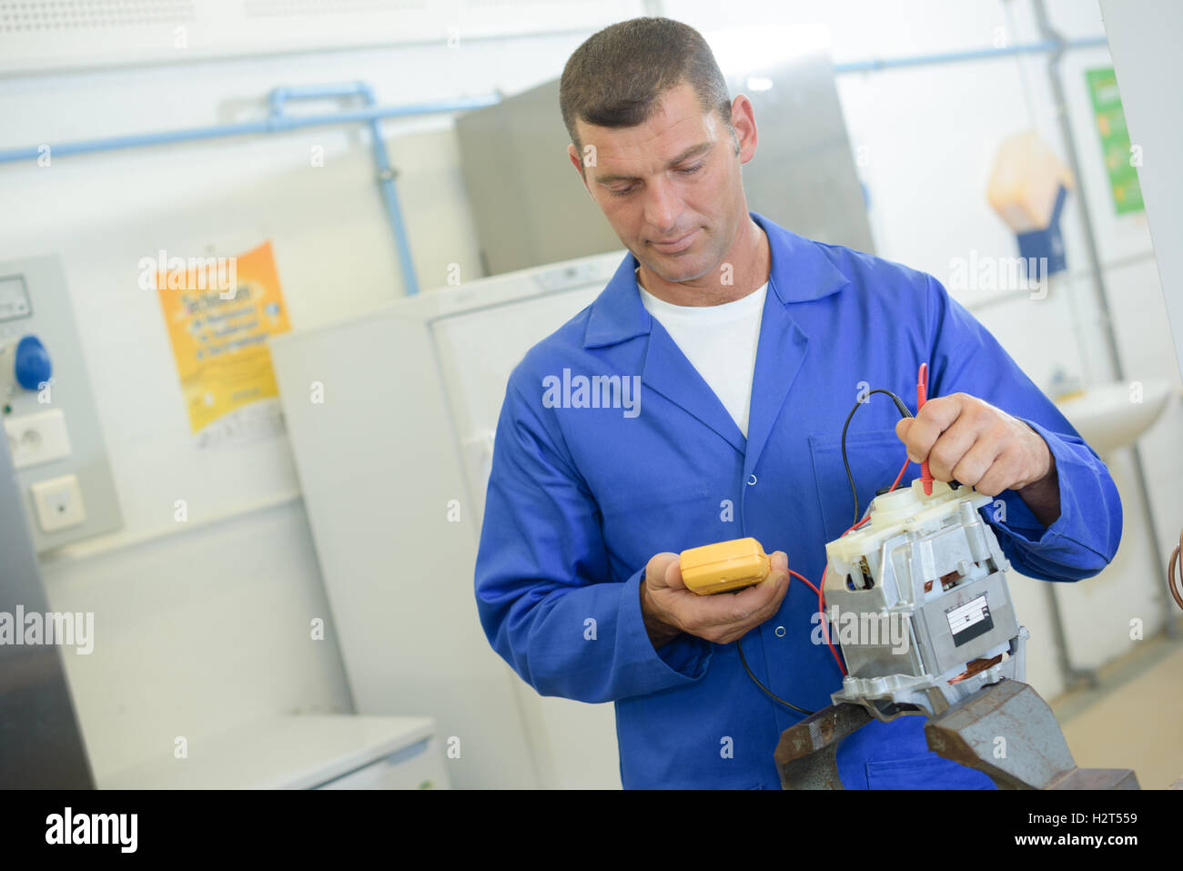 Electrician using multimeter Stock Photo - Alamy