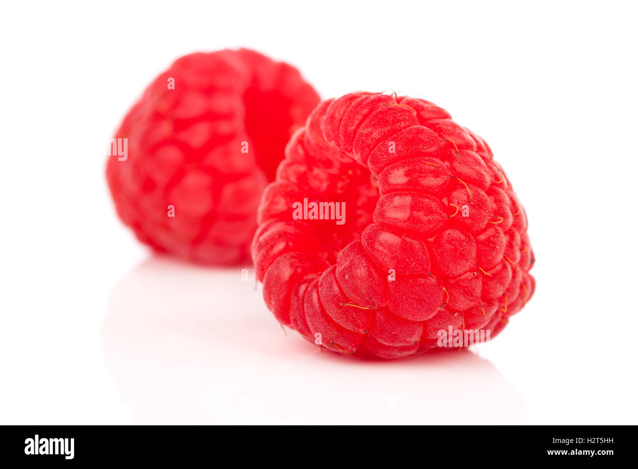 red raspberry on white background Stock Photo - Alamy