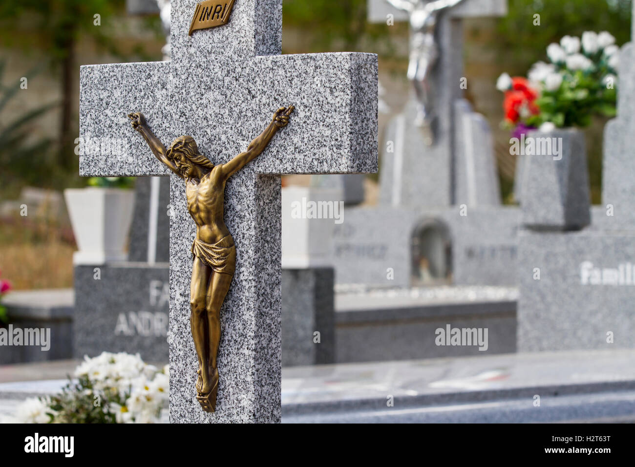 Jesus Christ on the cross in a cemetery Stock Photo - Alamy