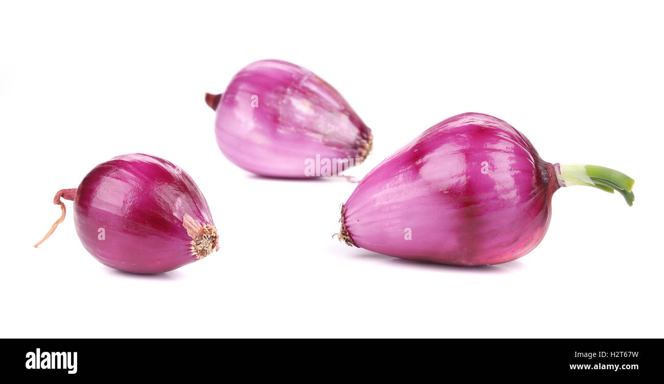 Three red onions Stock Photo - Alamy