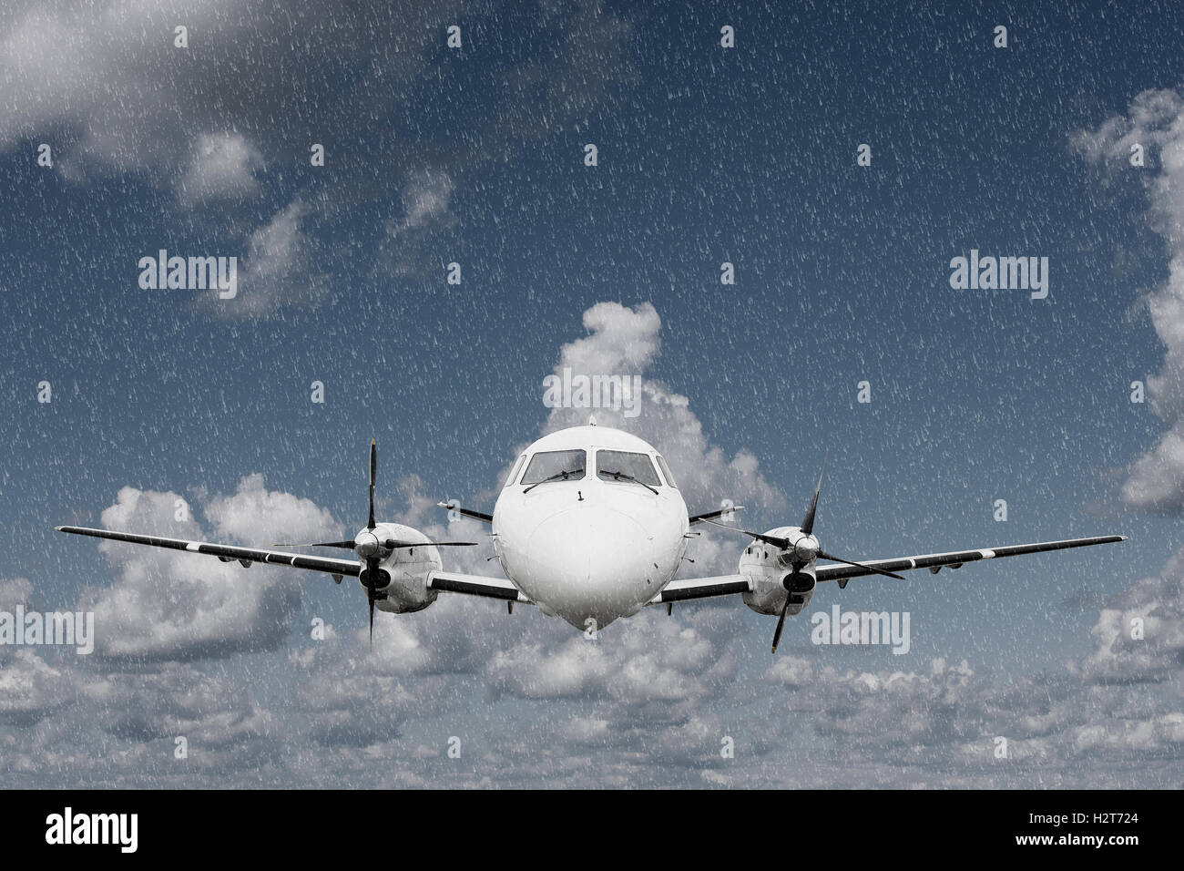 Airplane in the rain Stock Photo - Alamy