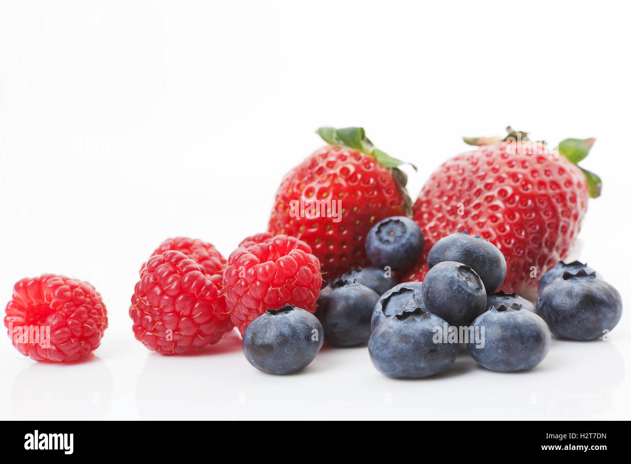 Raspberries, blueberries and strawberries. Delicious fruits Stock Photo ...