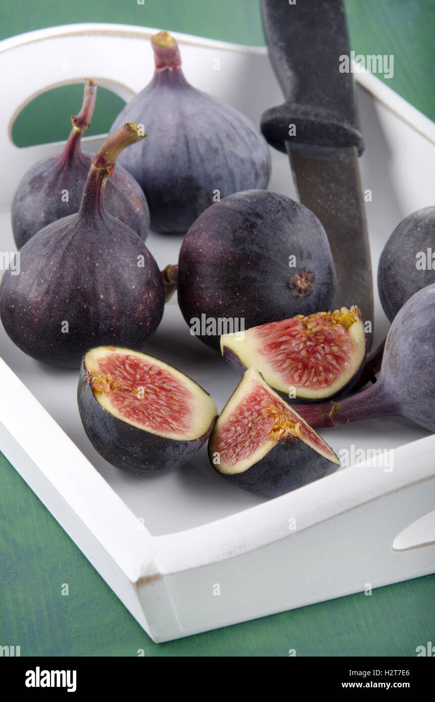 sweet fig and knife on serving tray Stock Photo - Alamy