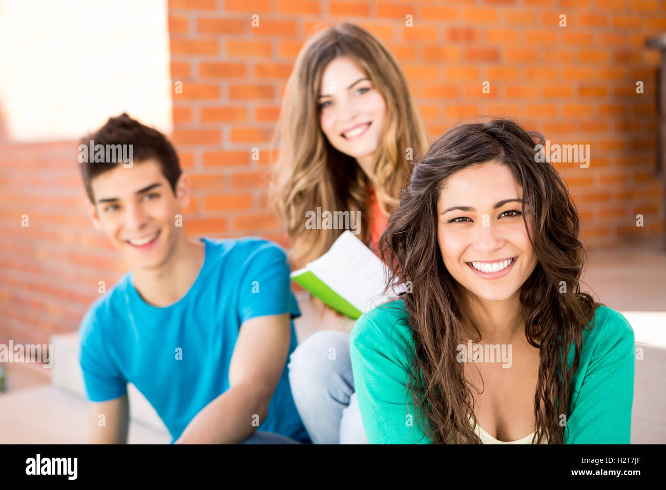Young group of students in campus Stock Photo - Alamy