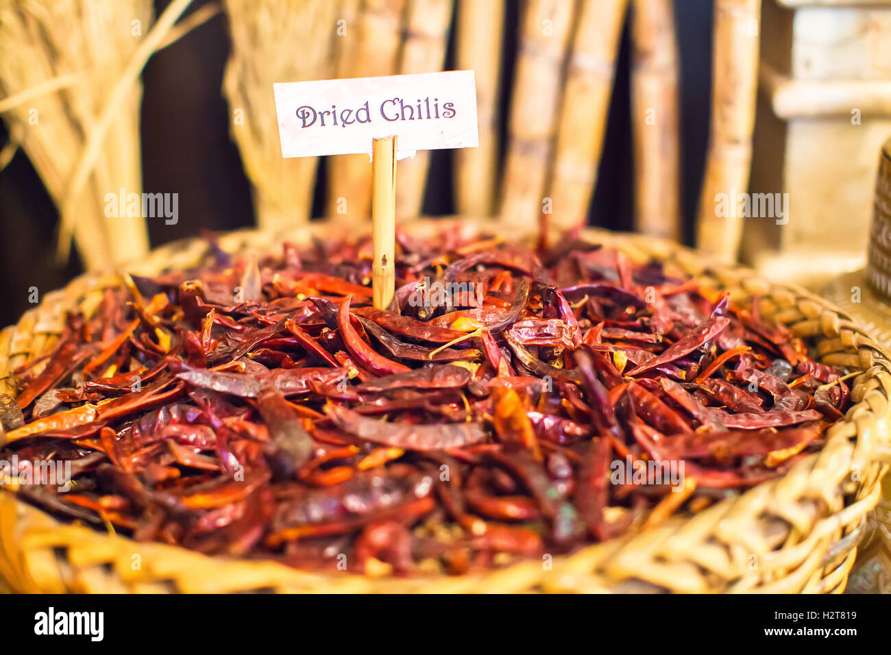 Dried chilis in a large basket Stock Photo - Alamy