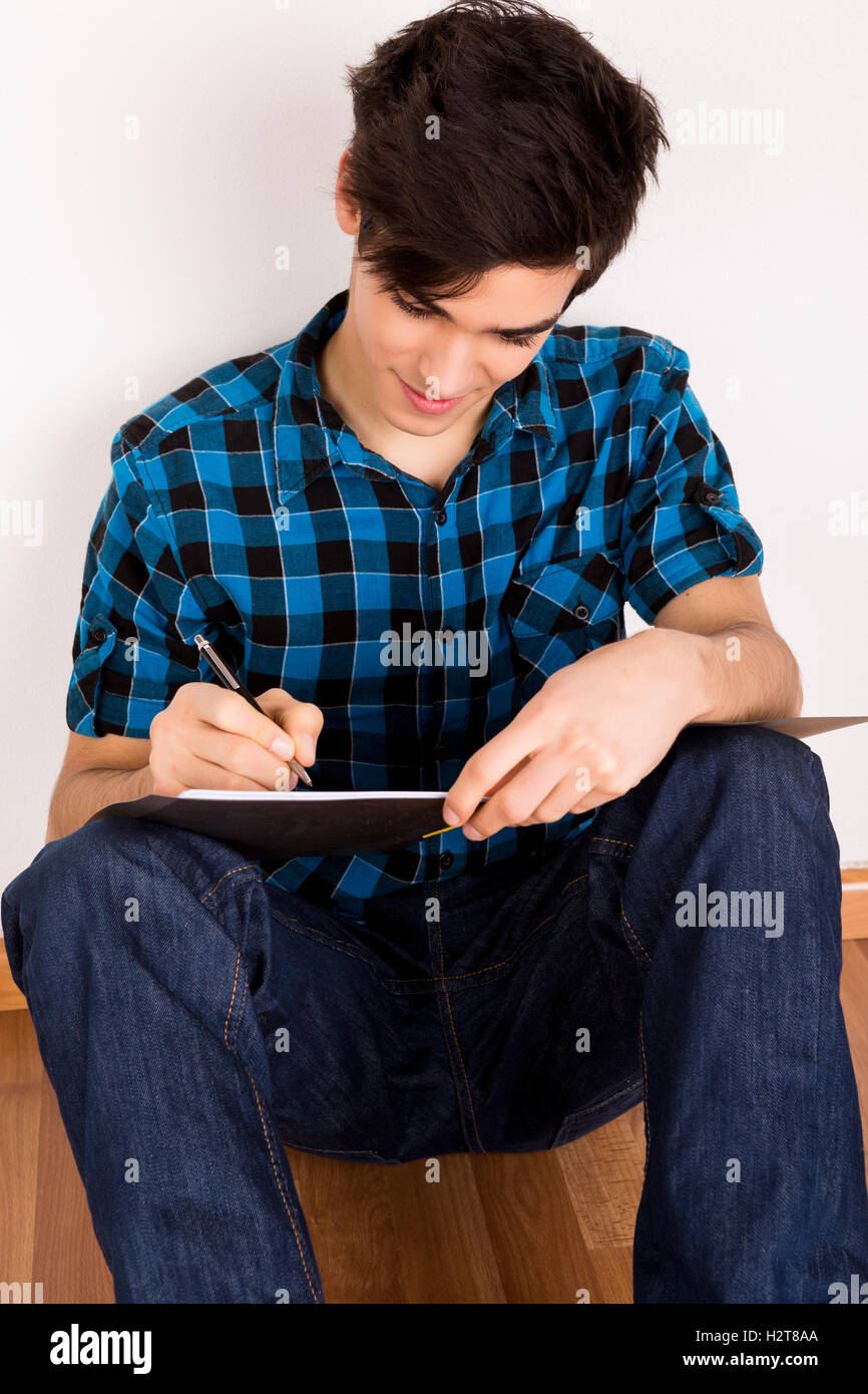 Young man studying at home Stock Photo - Alamy