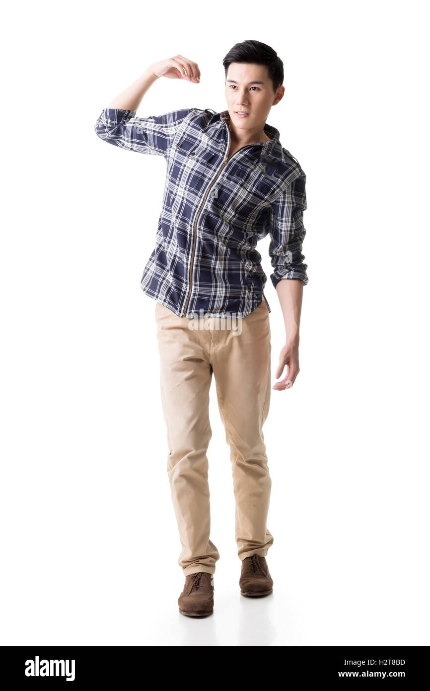 Asian young guy carry or take something Stock Photo - Alamy