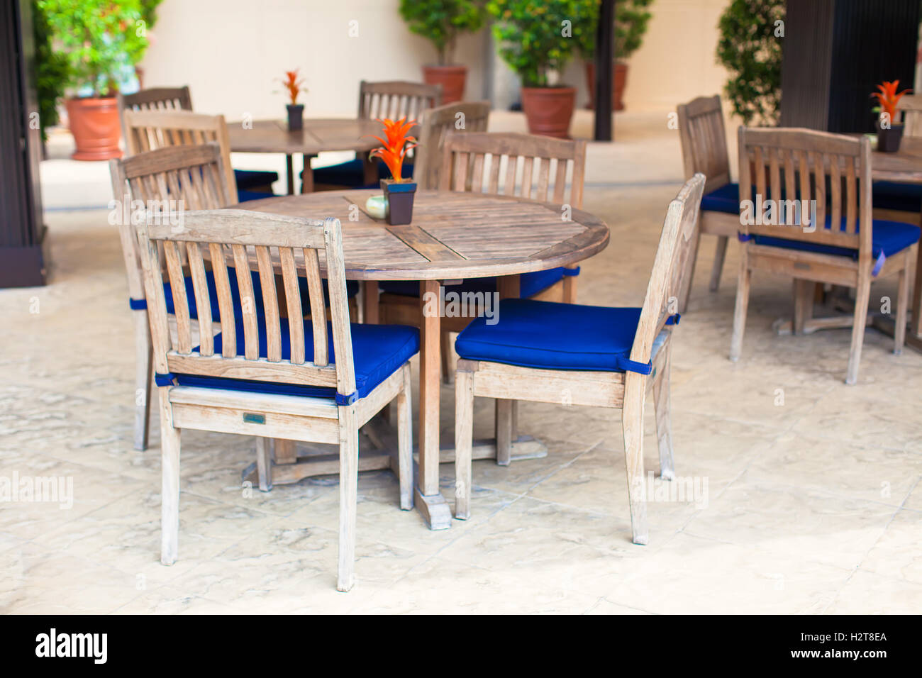 Hotel patio with wooden white furniture Stock Photo - Alamy
