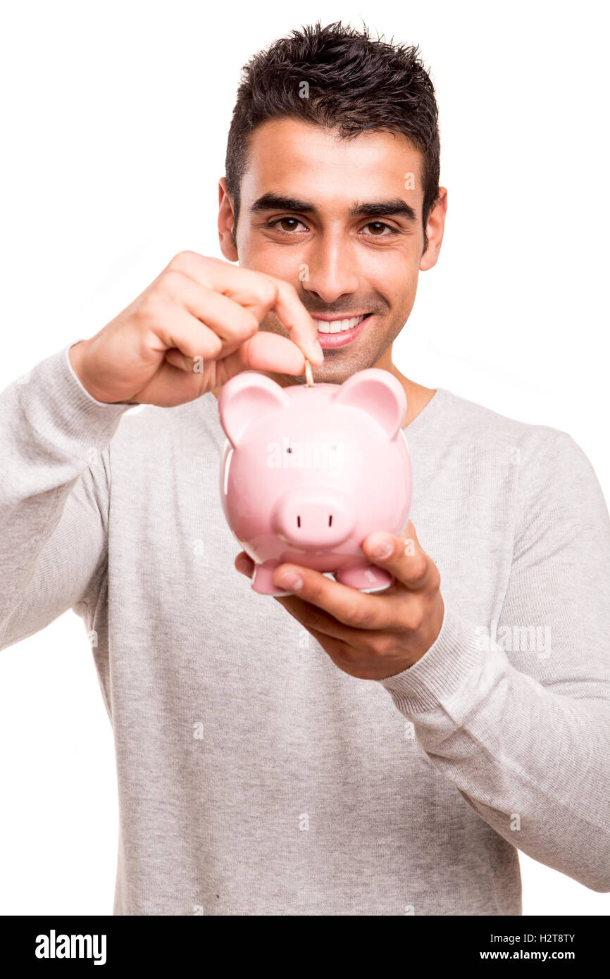 Man saving money to a piggy bank Stock Photo - Alamy