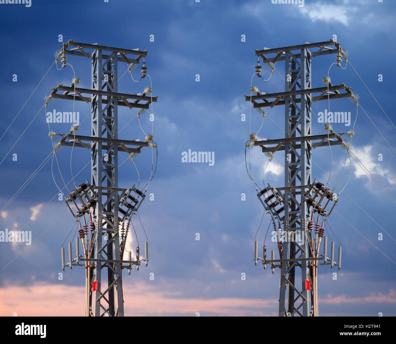 Electricity pylons with high-voltage wires Stock Photo - Alamy