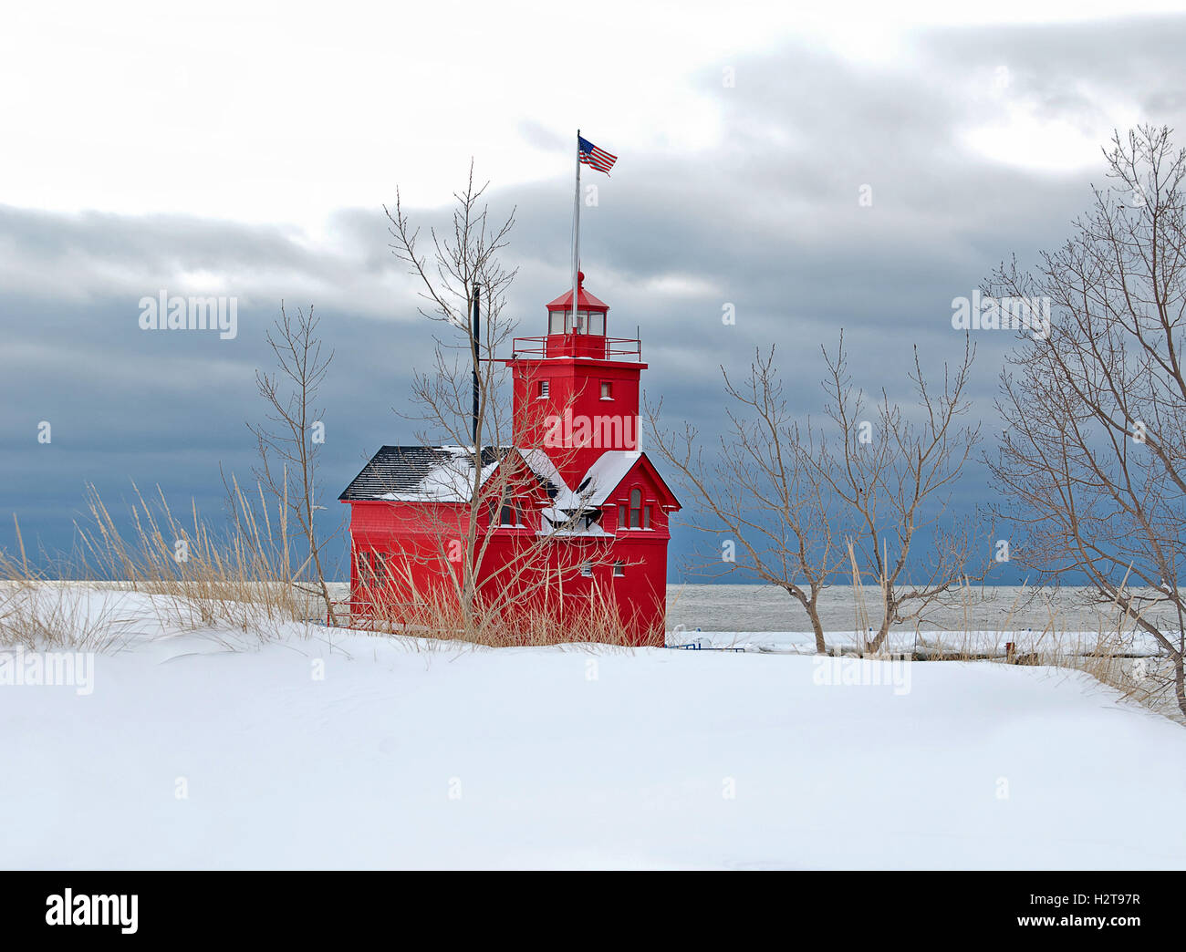bright red lighthouse in Holland Michigan harbor in winter Stock Photo ...