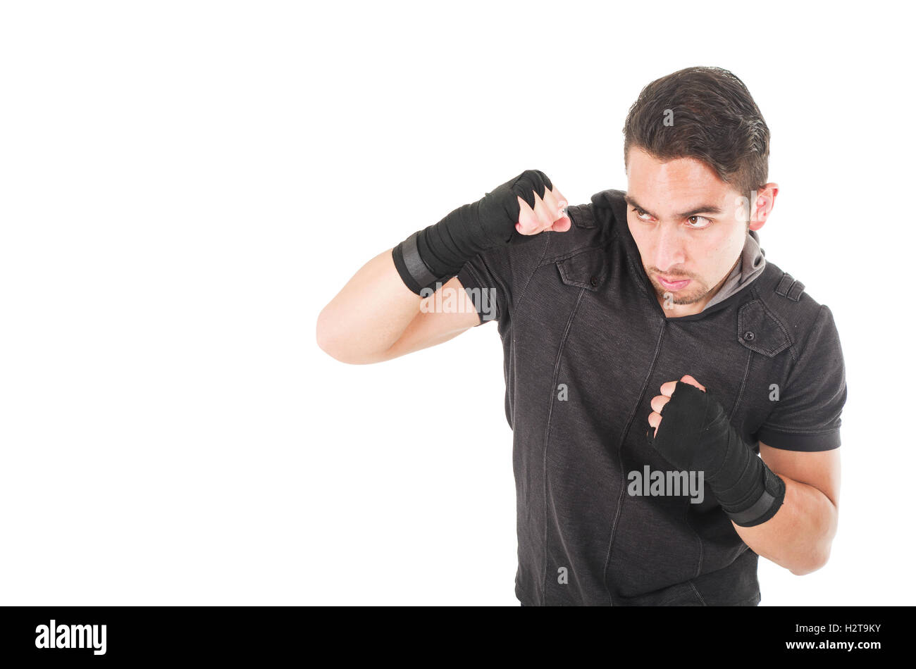 handsome latin fighter wearing black clothes training Stock Photo - Alamy