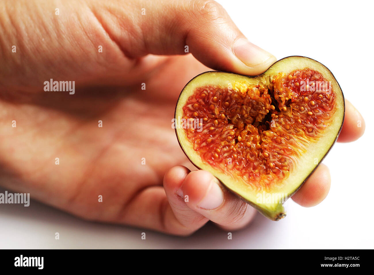 Hands holding figs in heart shape close up isolated beautiful photo ...