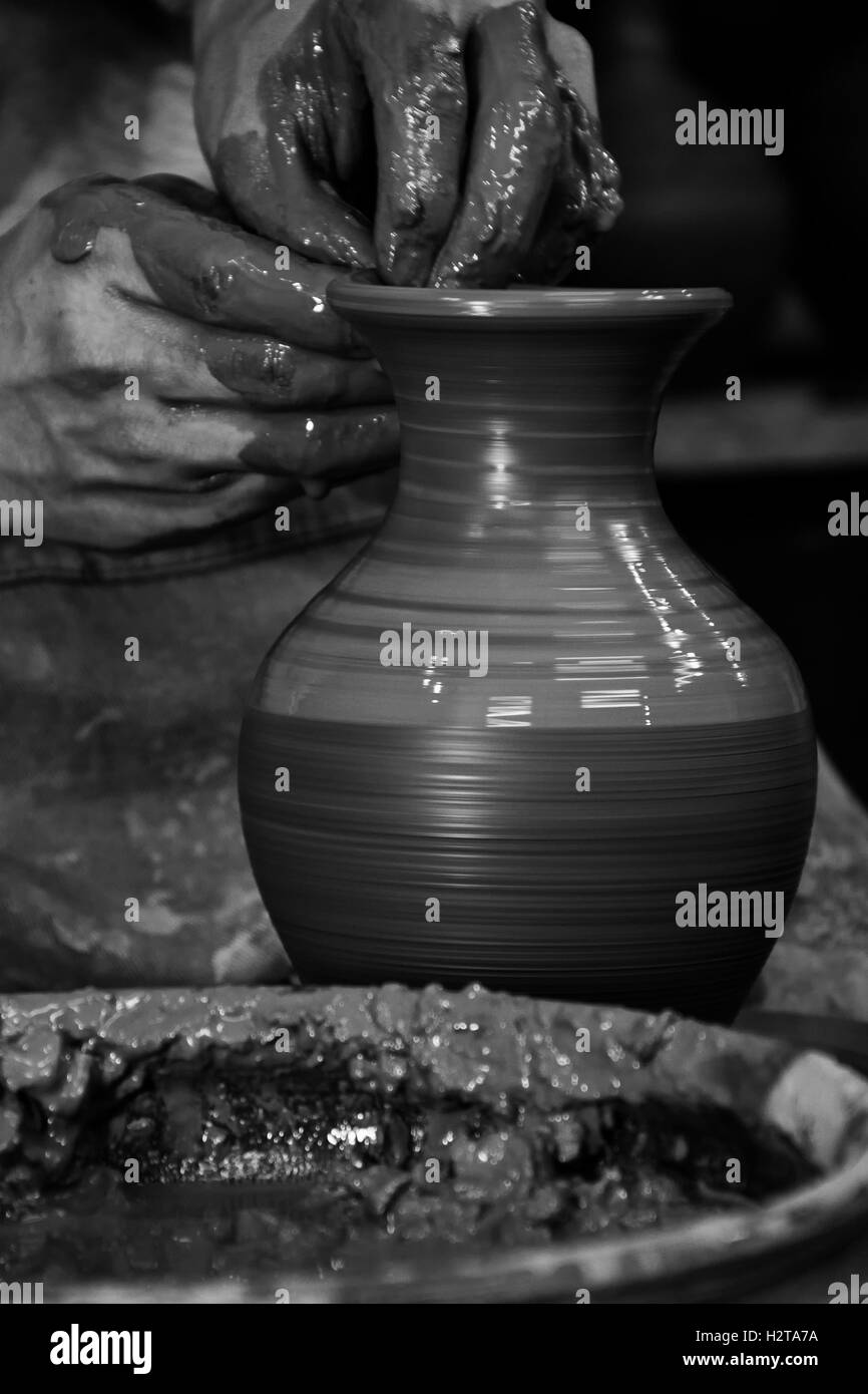 Craftsman hand making pottery Black and White Stock Photos & Images - Alamy