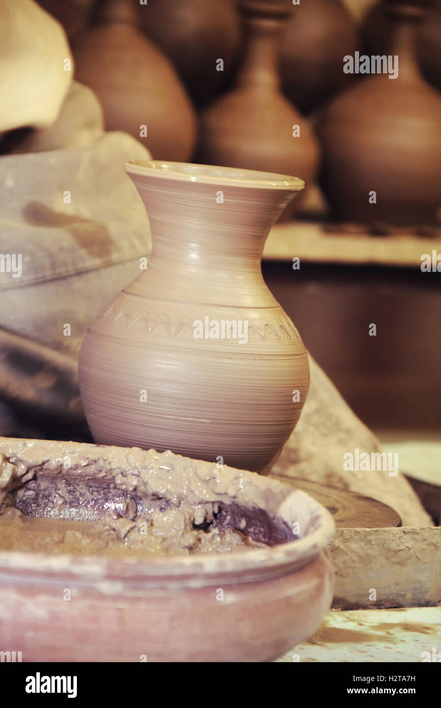 Ceramic pottery making proccess. Handmade clue pottery. Potter hands ...